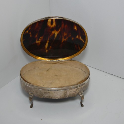 A small silver and tortoise shell decorative trinket box with a lift ...