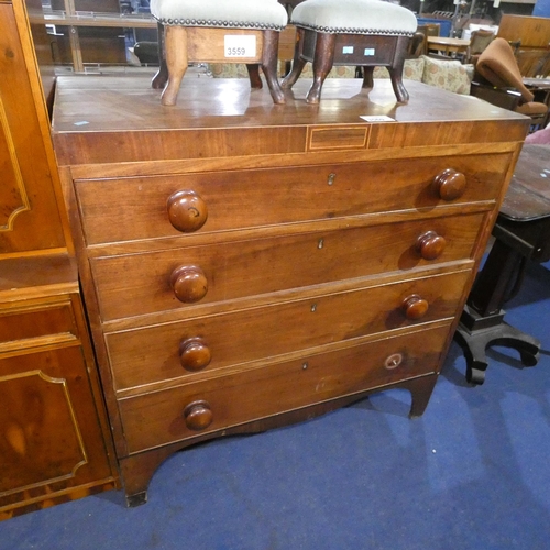 A 19th Century mahogany chest of four graduated drawers with turned ...