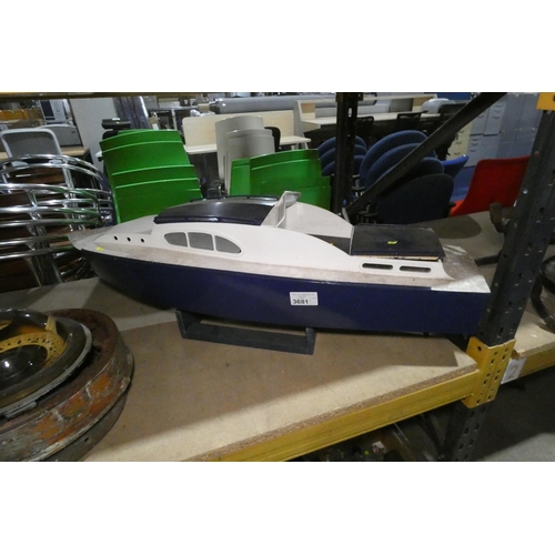 A large vintage wooden model speed boat