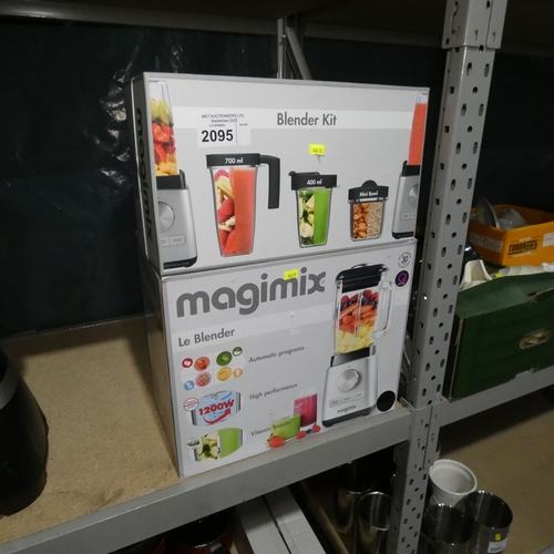 A boxed blender by Magimix and a boxed blender kit with various size ...