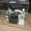 A microscope by Nomo with light and slides trade
