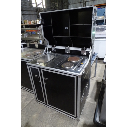 A commercial stainless steel mobile kitchen unit with sink, drainer ...