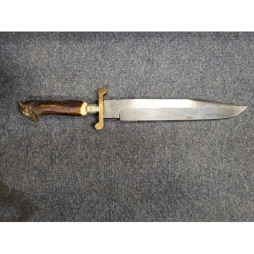 A decorative vintage fixed blade knife with stag antler handle, blade ...