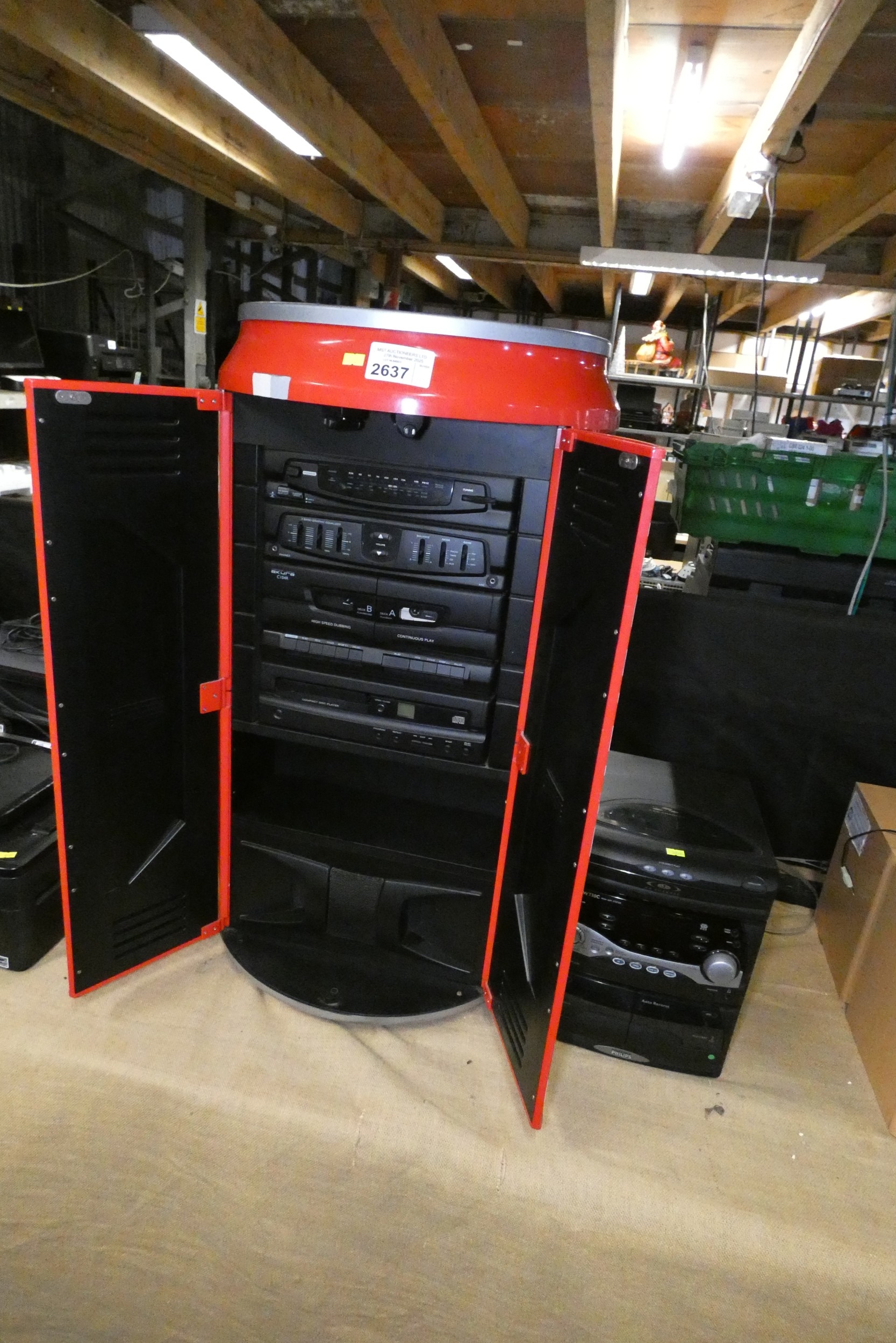 A large coca cola can stereo cabinet with built in stereo system and ...
