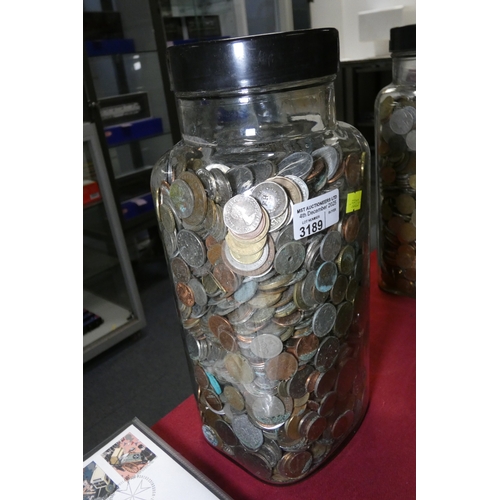 A large jar of collectors coins