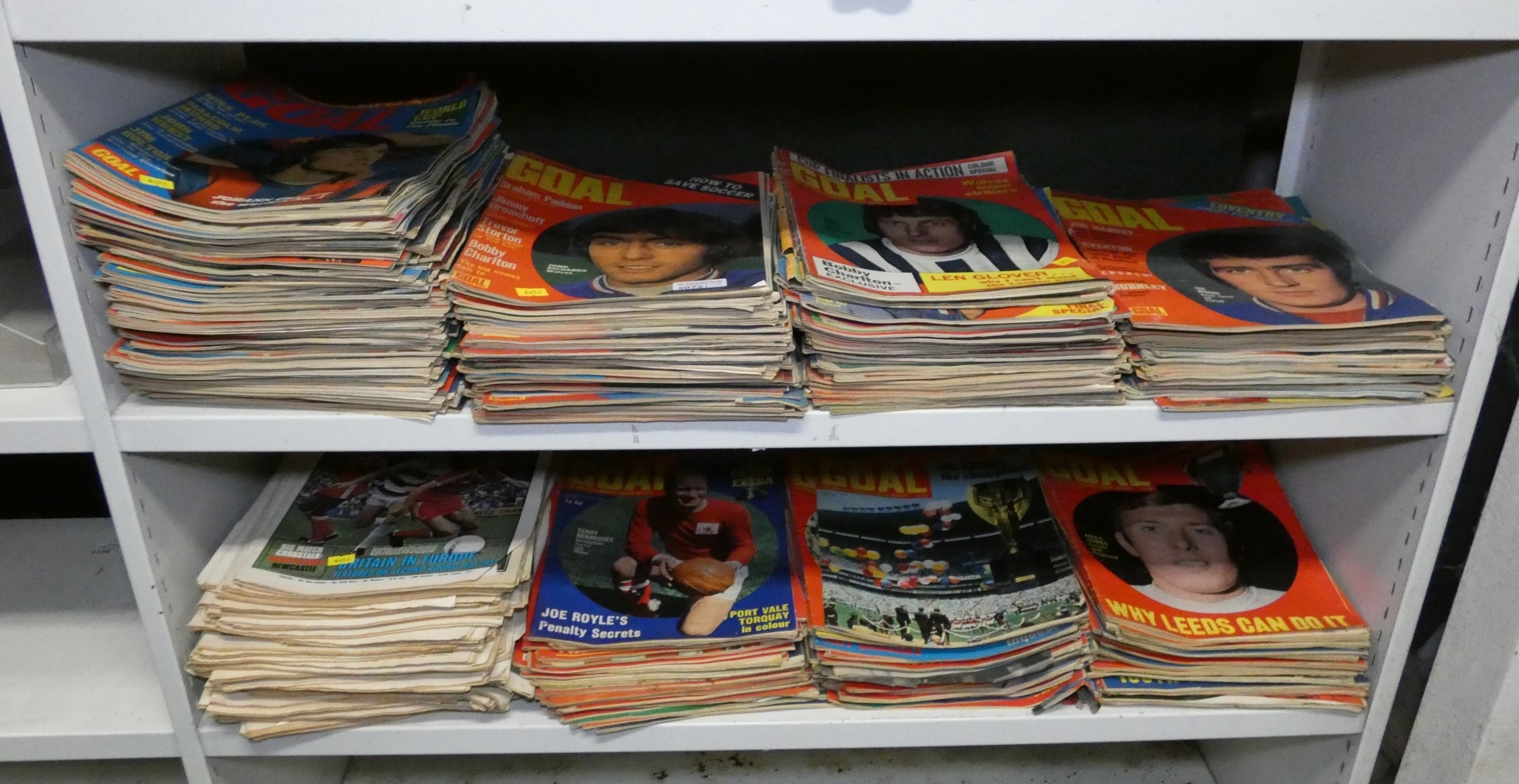 A collection of vintage football magazines (two shelves)