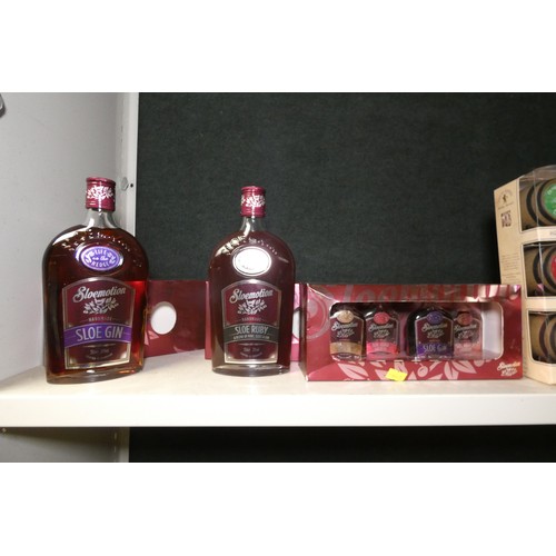 A boxed bottle of Harrington Dry Gin, a boxed bottle of Vallegre Ruby ...