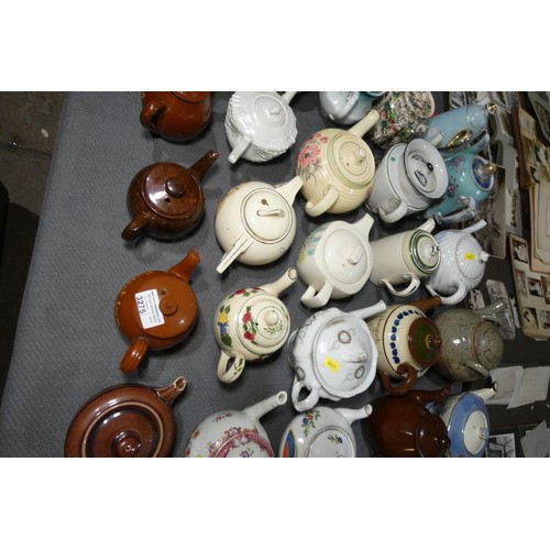 A collection of small decorative vintage teapots