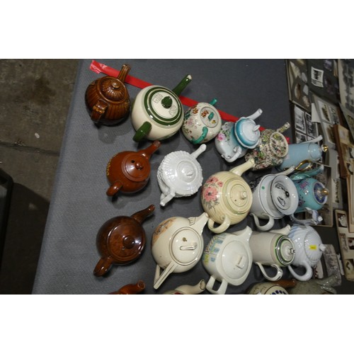 A collection of small decorative vintage teapots
