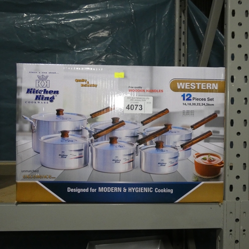 A 6 piece cookware set with lids by kitchen king type western, boxed