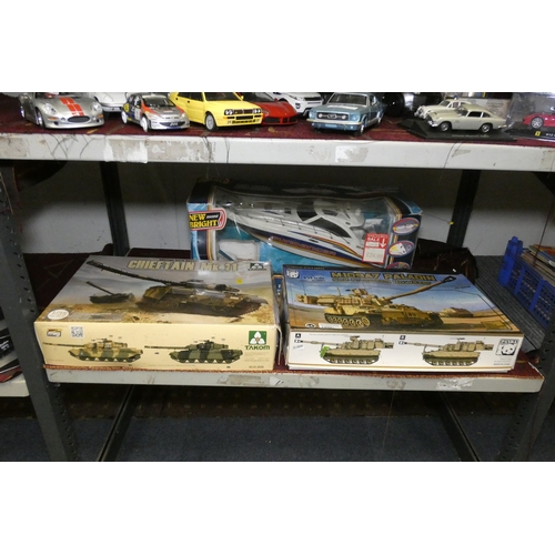 Two boxed vintage model tank kits, to be assembled and a vintage model boat
