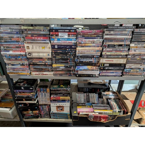 A quantity of various DVDs, boxsets contents of 2 shelves