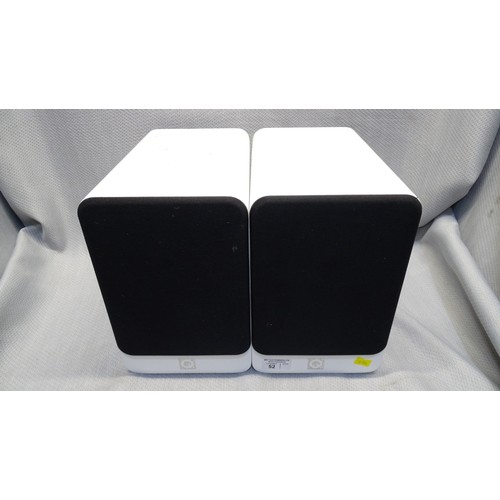 A pair of white Q Acoustics 2020i Bookshelf Speakers