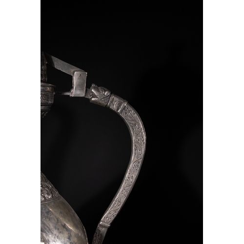 A Indo-Persian White Metal Ewer This elaborately decorated ewer ...