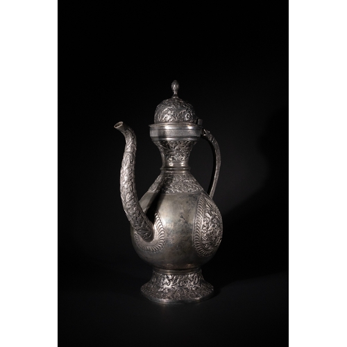 A Indo-Persian White Metal Ewer This elaborately decorated ewer ...