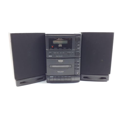 A MATSUI MCH 650 compact CD and tape player with speakers and power ...