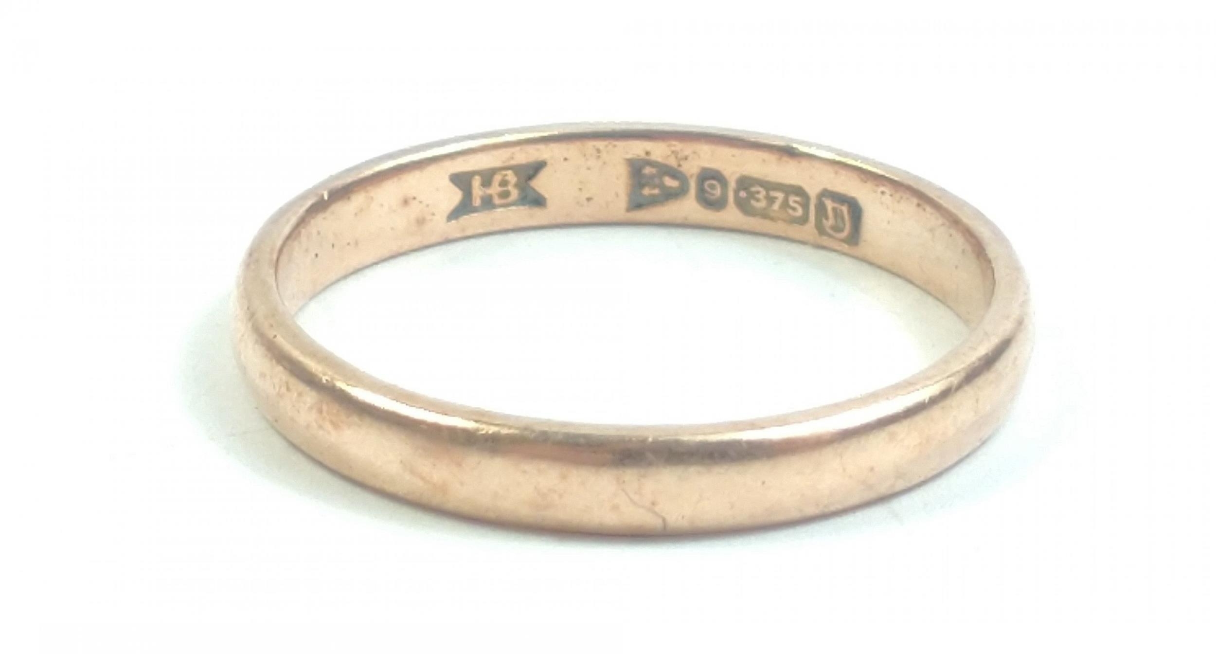 Gold wedding band with full 9ct hallmarks. Size K, weighs 1.3g approx.#1