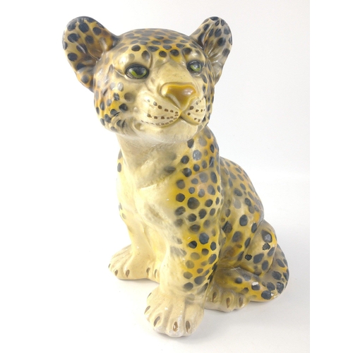 A plaster leopard cub standing approx 25cm high. A few chips missing ...
