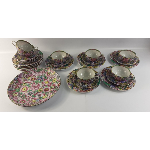 A highly decorative tea service in fine delicate china, decorated in ...