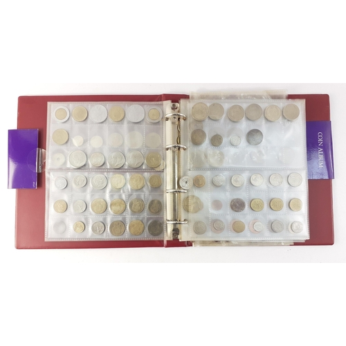 A super WH SMITH coin album filled with foreign coins of various ...