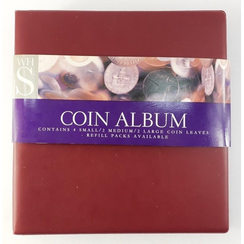 A super WH SMITH coin album filled with foreign coins of various ...
