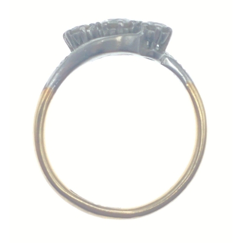 An 18ct stamped gold / platinum ring with three lovely diamonds on ...