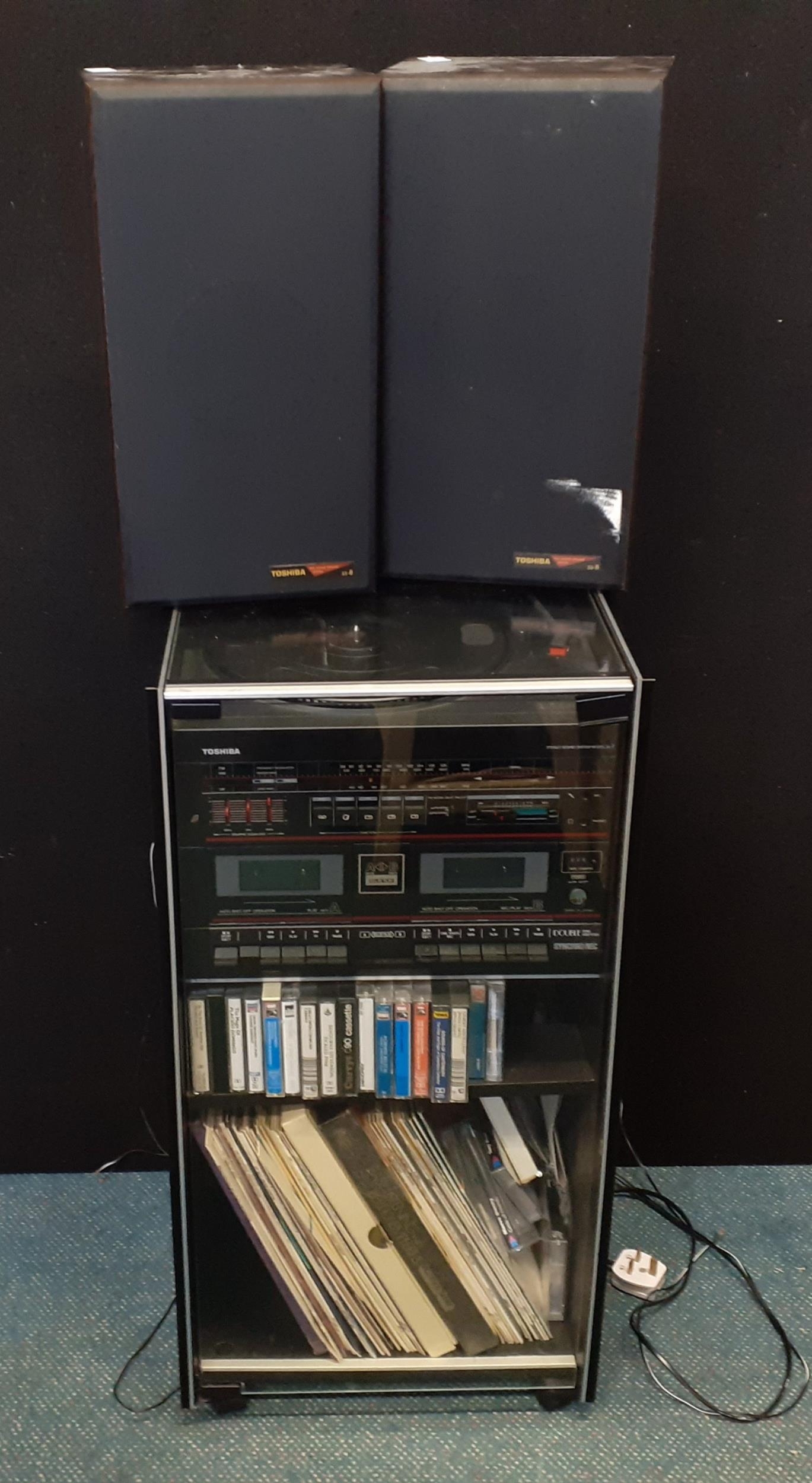 A TOSHIBA SL7 Stereo System in cabinet with speakers and a selection of ...