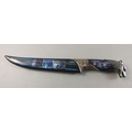 A modern decorative knife in hard sheath with Wolf Head finial. The ...