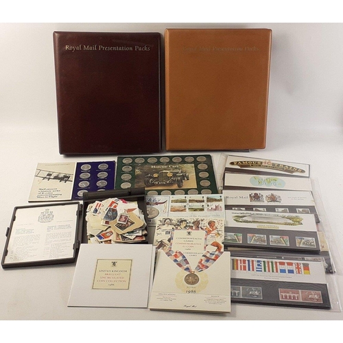 Two padded stamp folders containing good quality presentation packs to ...