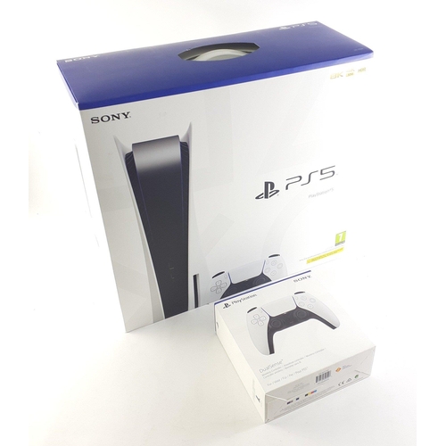 PS5 boxed with a boxed controller and cables etc - in good condition ...