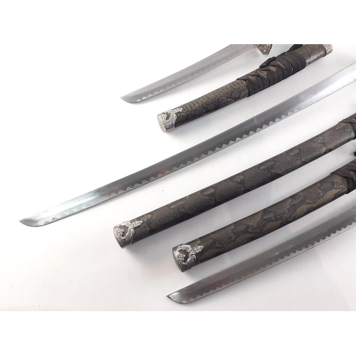 Three modern Japanese swords. Two Samurai swords with 68cm, 48cm and ...