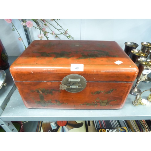 A CHINESE RED LACQUERED AND GILT DECORATED WOODEN BOX WITH METAL END ...