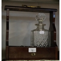 A MODERN MAHOGANY TANTALUS FRAME, WITH ONLY ONE CUT GLASS DECANTER AND ...