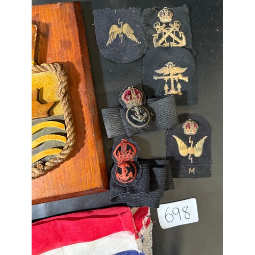 Collection of military items including ship’s crest plaque, badges ...