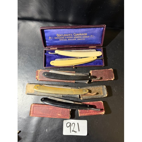 Collection of vintage cut throat razors in cases