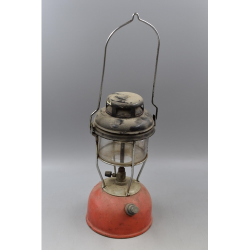 A Vintage Tilley Oil Lamp, In Red. Approx 13" Tall.