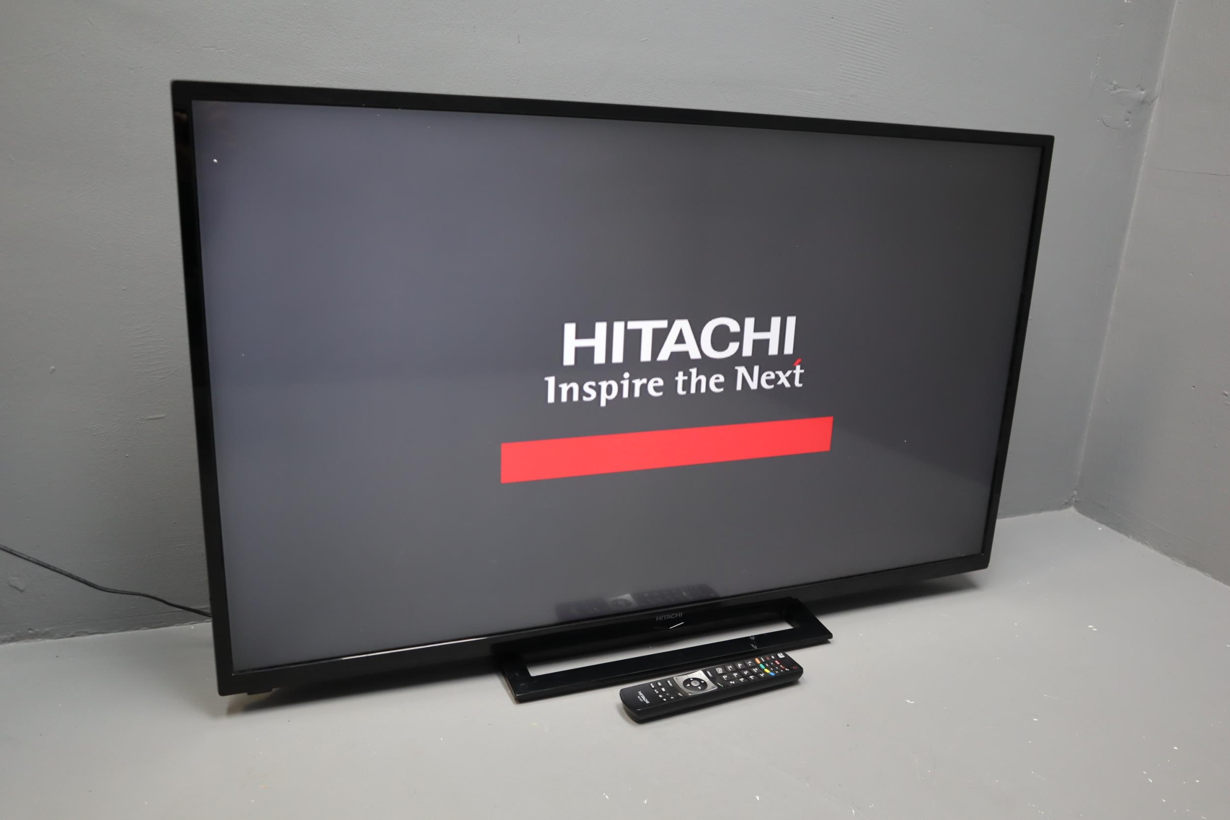 A Hitachi 50HYT62U C TV, With Remote. Powers on When Tested.