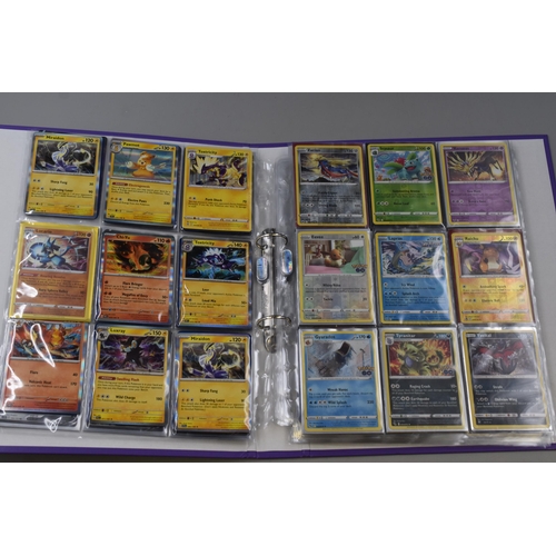 Binder Containing a Large Selection of Modern Pokémon Trading Cards