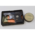 A boxed Fritum blank firing staring pistol with a tin of cartridges