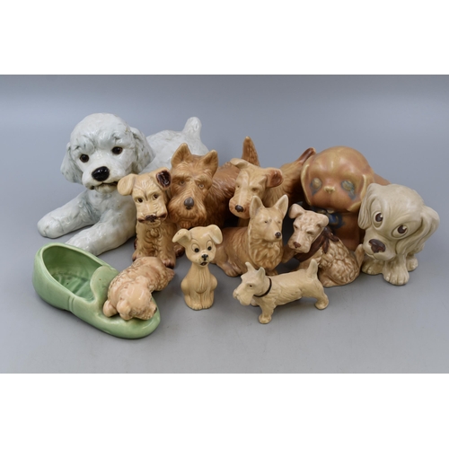 A selection of Sylvac dogs to include big and small (mostly beige)