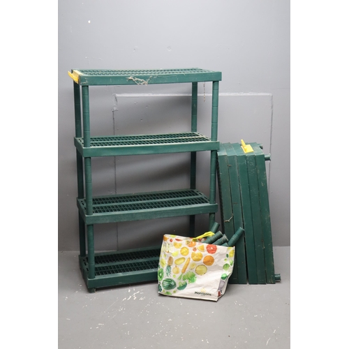 Nine sections of green plastic racking with connecting tubes/legs ...