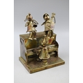 Brass musical box with moving figures, working when tested, measures 7 ...