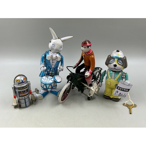 Four Mechanical Tin Plate Clockwork Figures complete with Keys