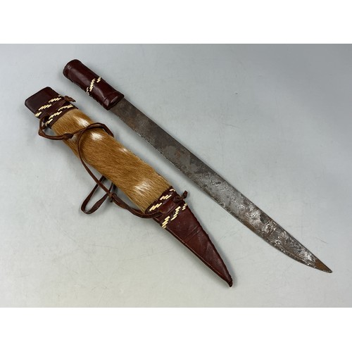 A South African Tribal Deerskin Sheath Dagger, Approx 52cm Long