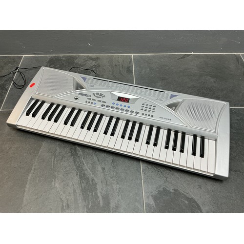 An Acoustic Solutions MK-2054 Electronic Keyboard. Powers On When Tested