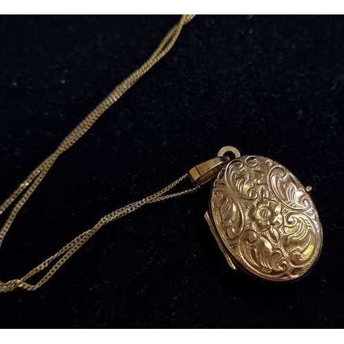 An attractive, ornamental 9ct gold locket, with a matching 9k chain ...