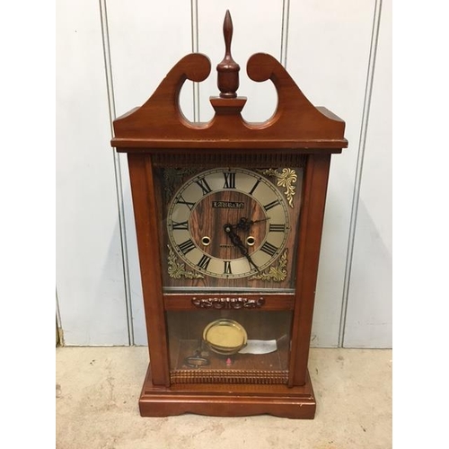 A vintage 'Laurain' 31-day pendulum wall clock. Complete with keys ...
