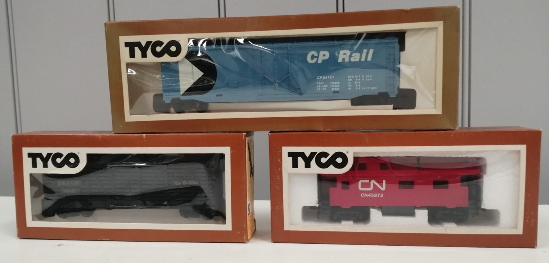 A collection of seven, boxed HO scale Wagons & Engine, by 'Tyco' & Cox ...
