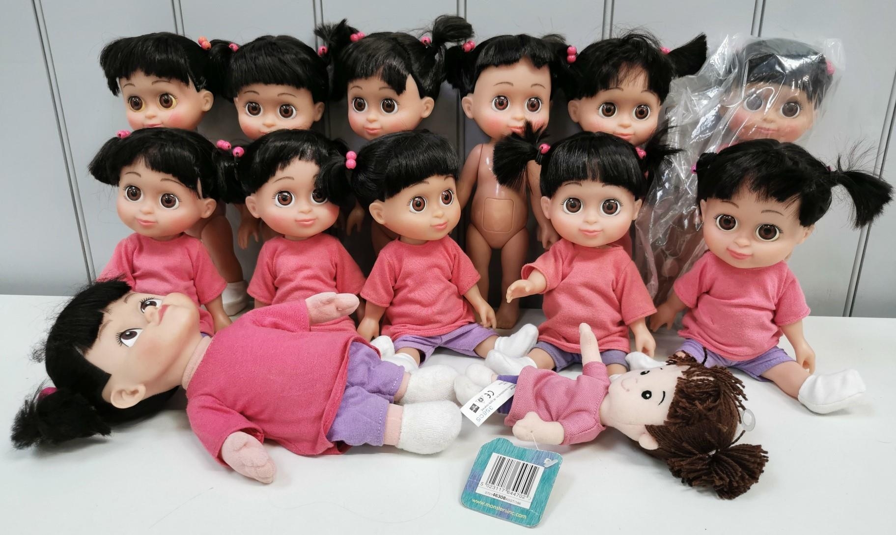 A selection of thirteen Boo dolls from Monsters Inc. All official ...