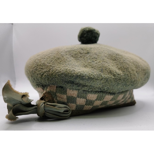 A WWI period 'Tam O Shanter' hat, with a Cameron Clan badge. Made by ...
